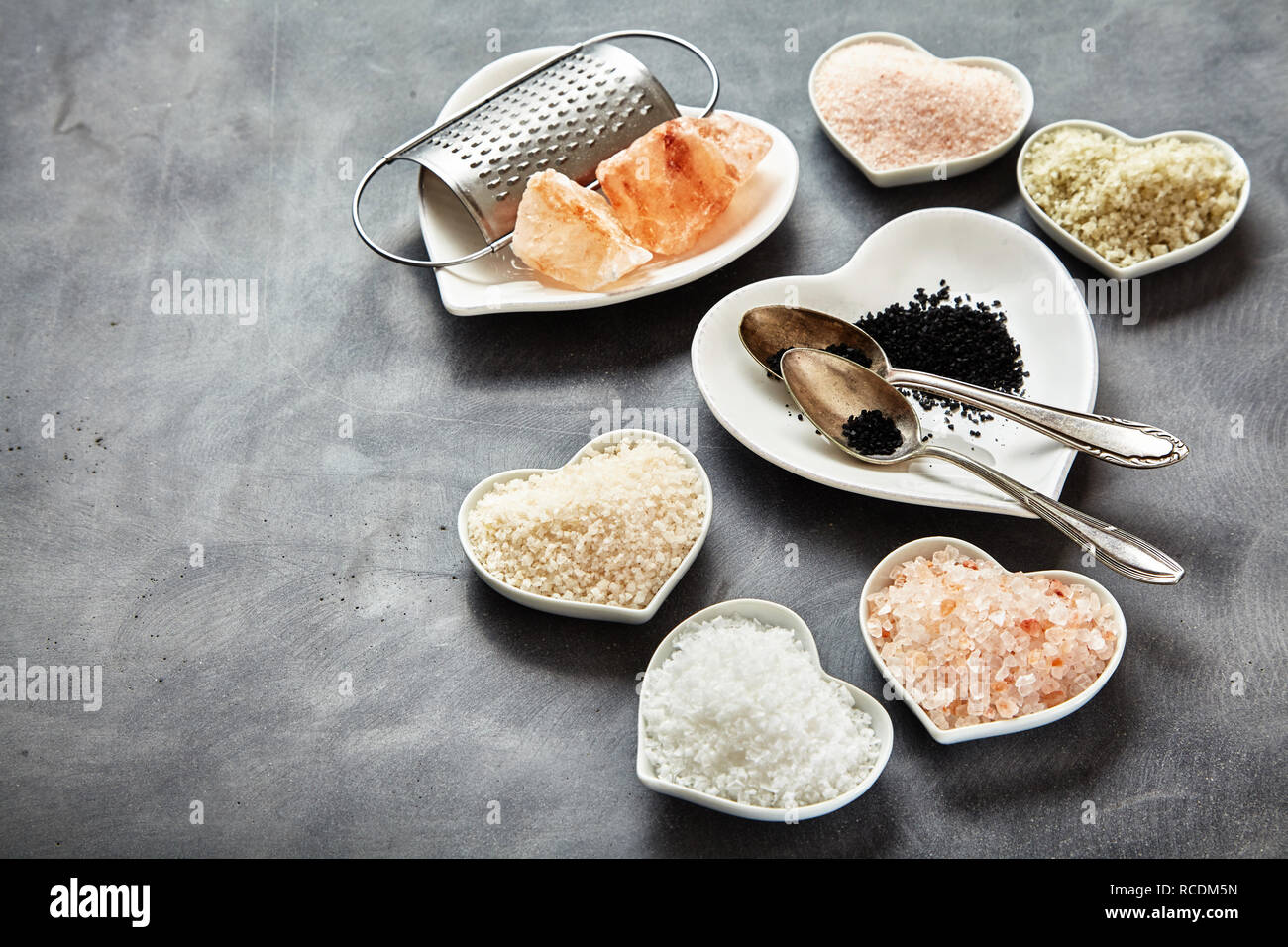 Display of assorted natural sea and rock salts from around the world in ...