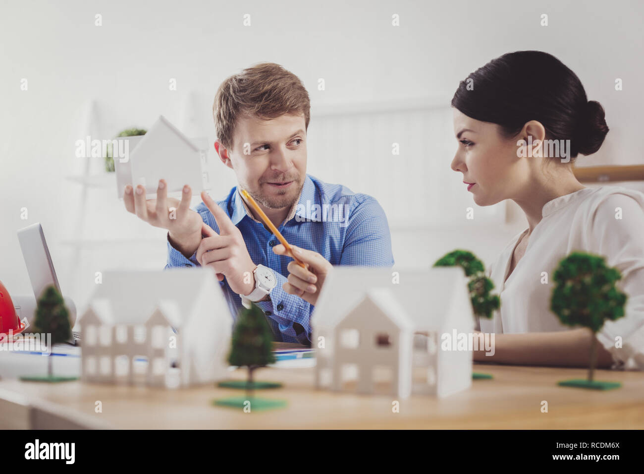 Joyful smart people working in team Stock Photo - Alamy