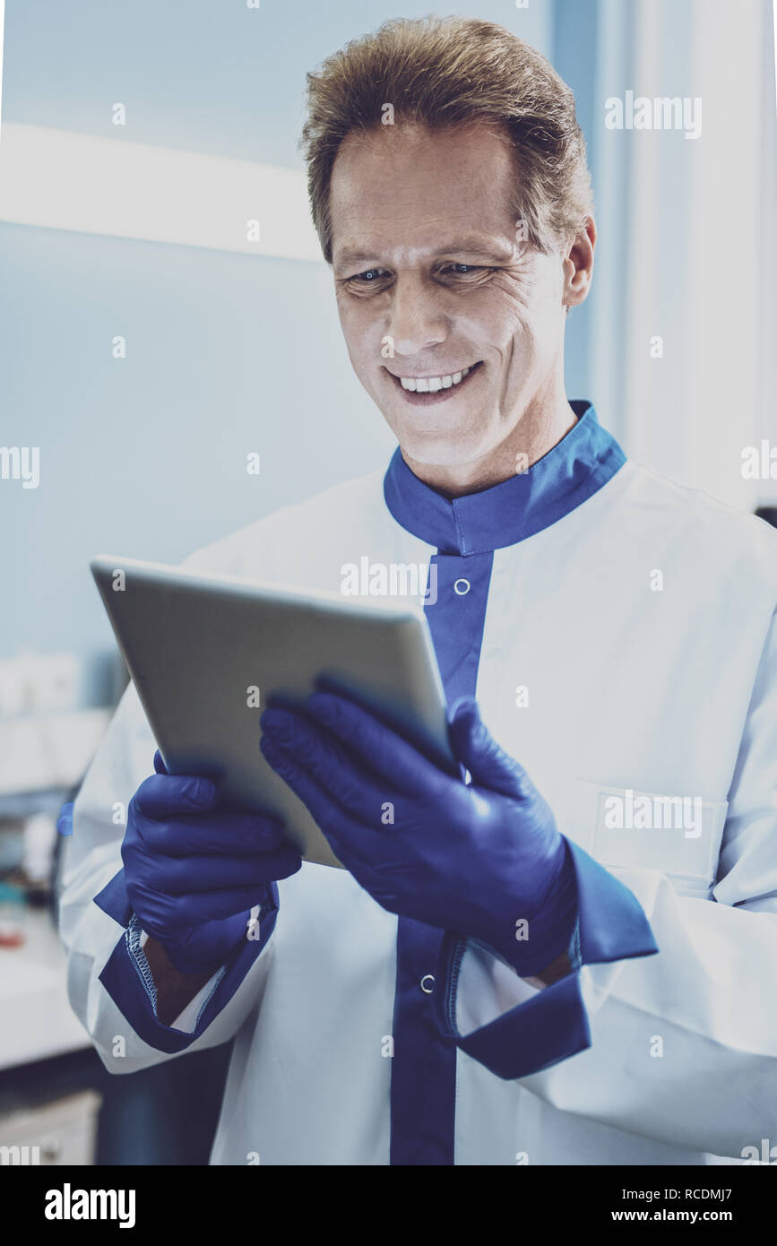 Happy male person working in laboratory Stock Photo - Alamy