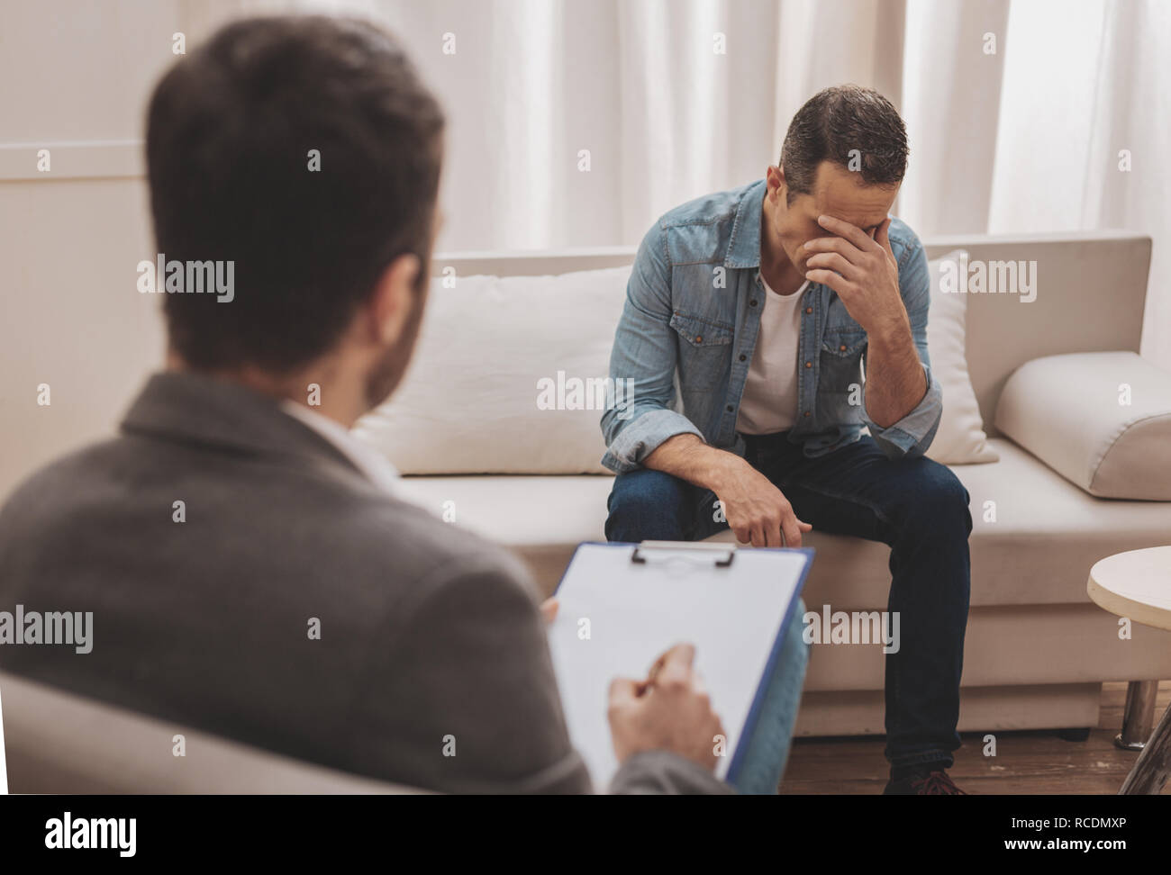 Mature exhausted man feeling overloaded and stressed Stock Photo - Alamy