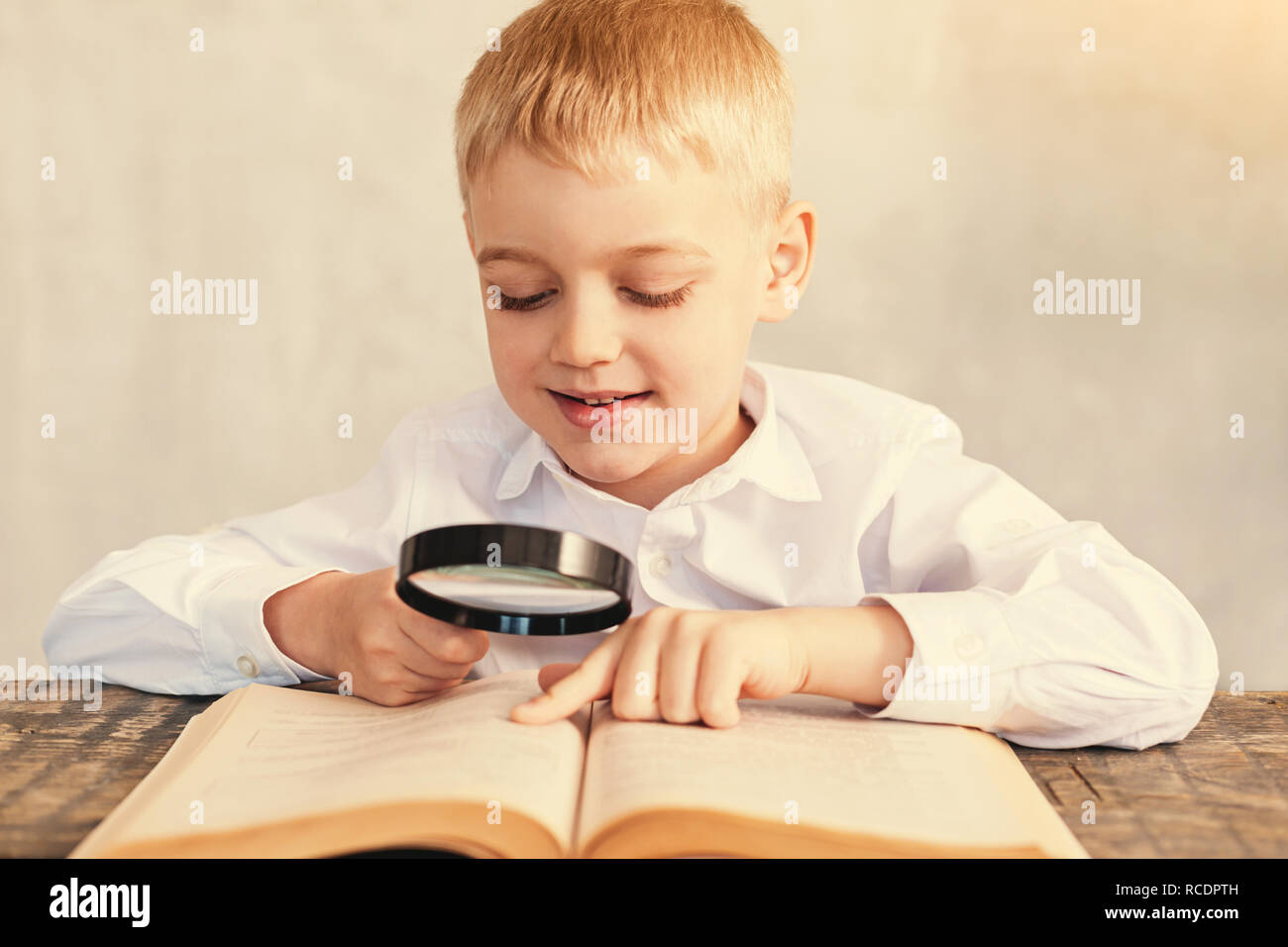 Using a magnifying glass to read hi-res stock photography and images ...
