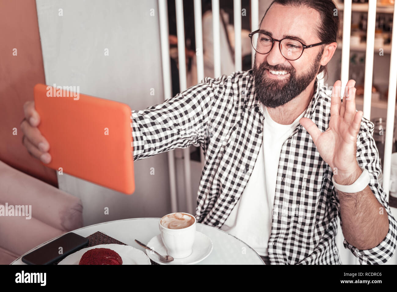 Man chatting with his friend via video call Stock Photo - Alamy