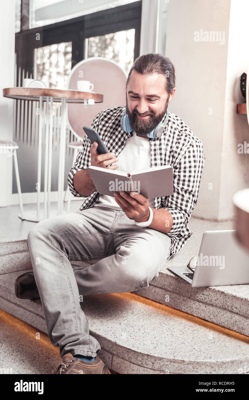 Man calling to his client while working Stock Photo - Alamy