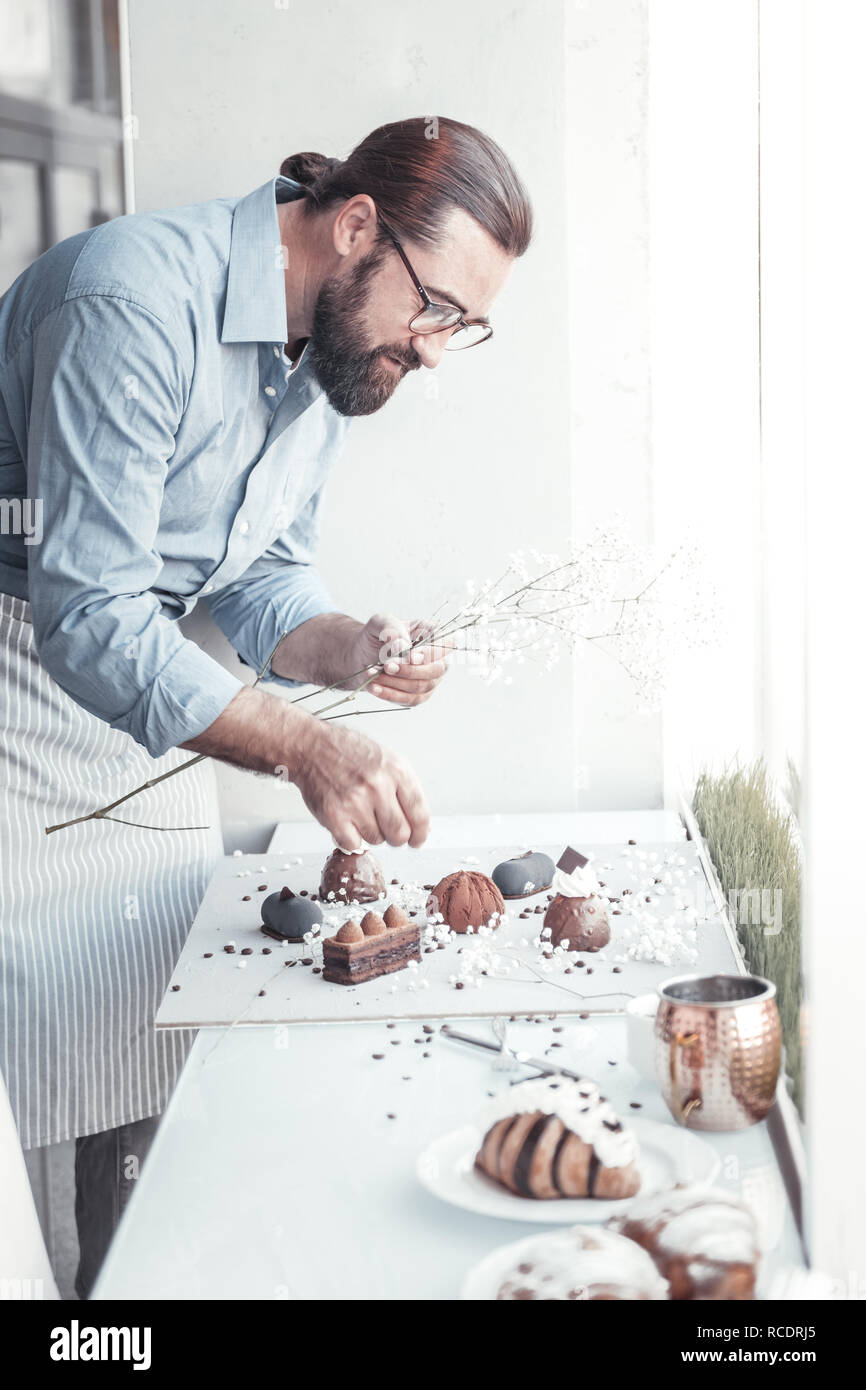 Man creating still lifes for the food photo Stock Photo - Alamy