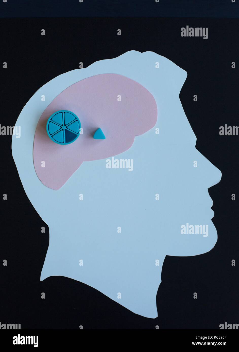 Cut paper silhouette of man with brain and "missing pieces Stock Photo ...