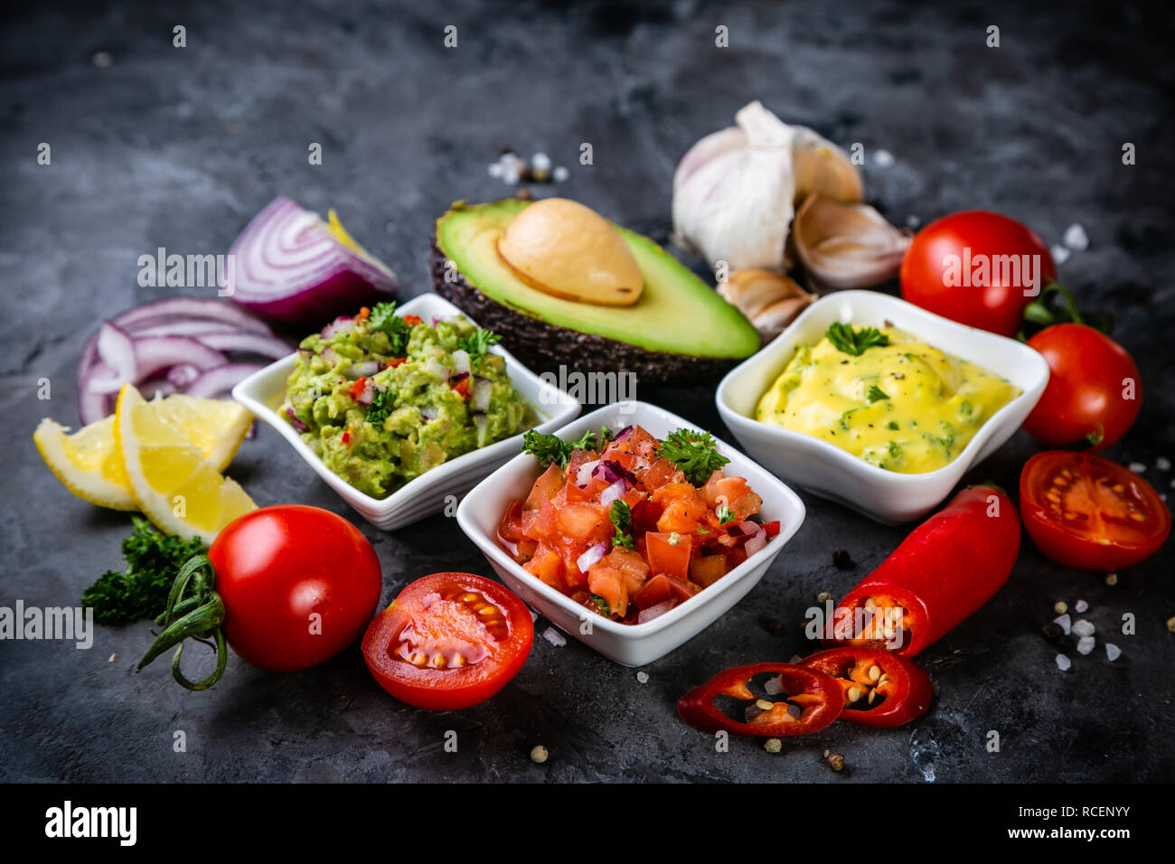 Selection of mexican sauces - salsa, guacamole, cheese sauce and ...