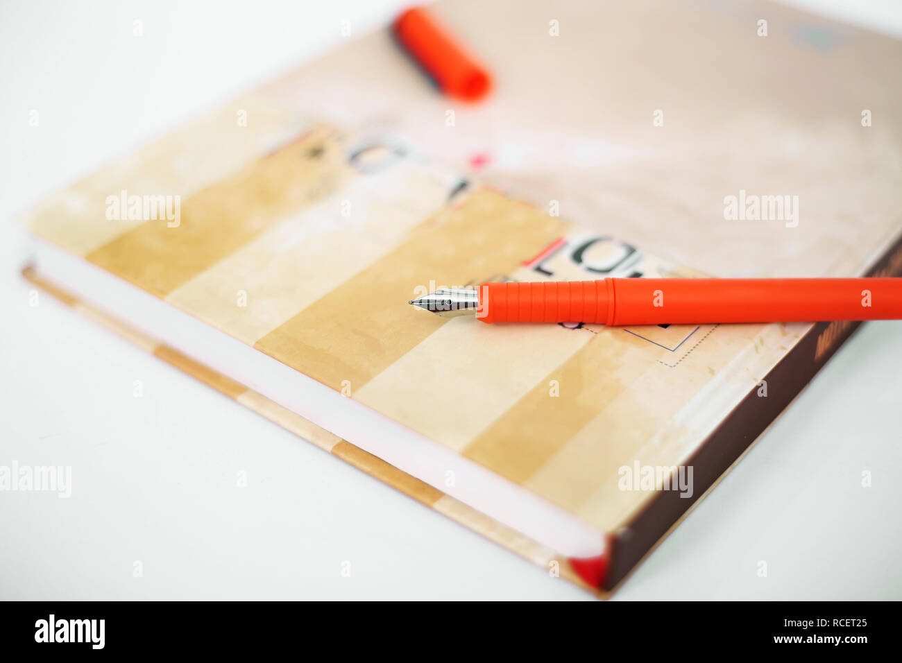 Picture of pen on the closed diary. Isolated on the white background ...