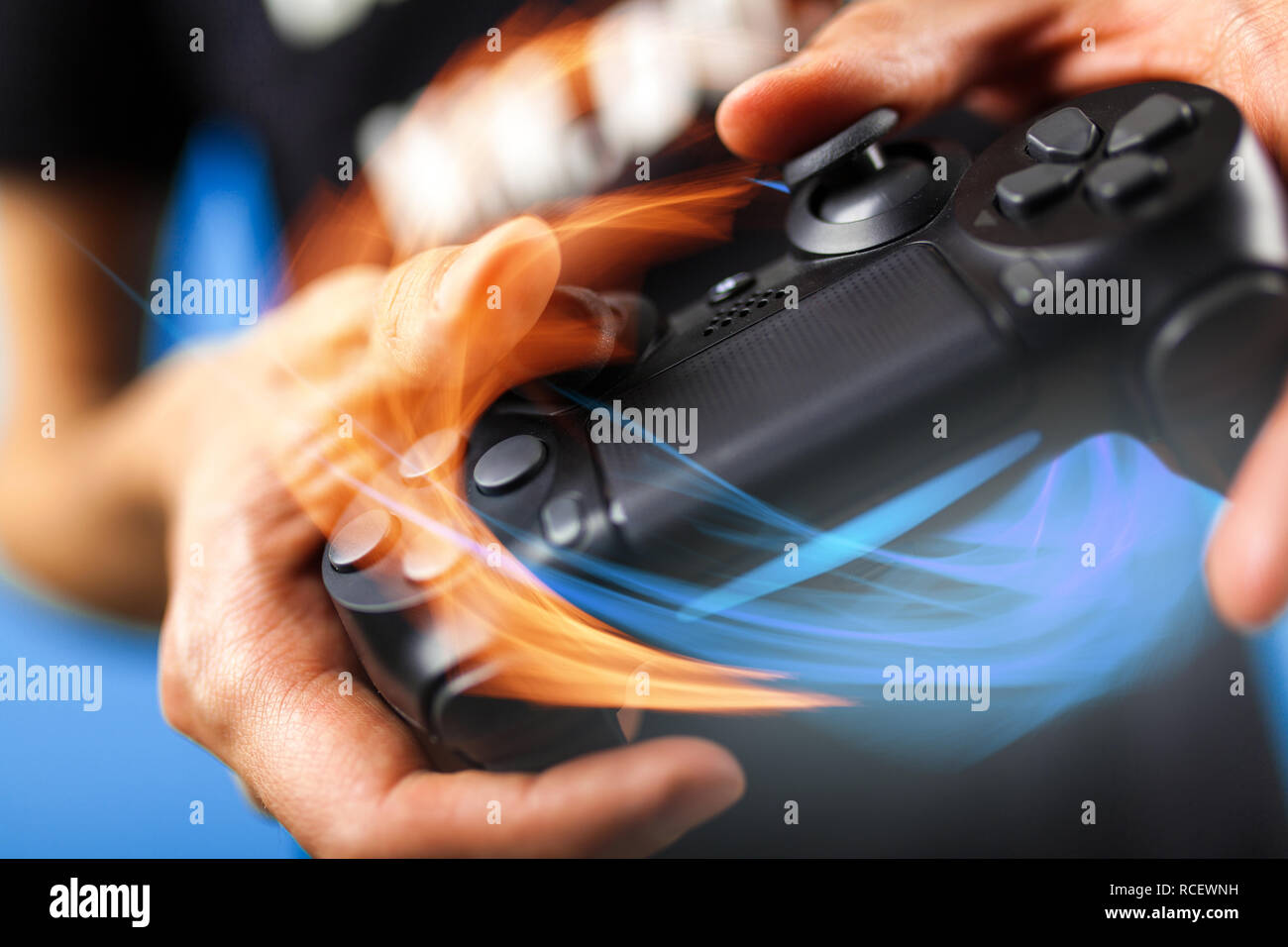 Male hands holding a gaming console controller Stock Photo - Alamy