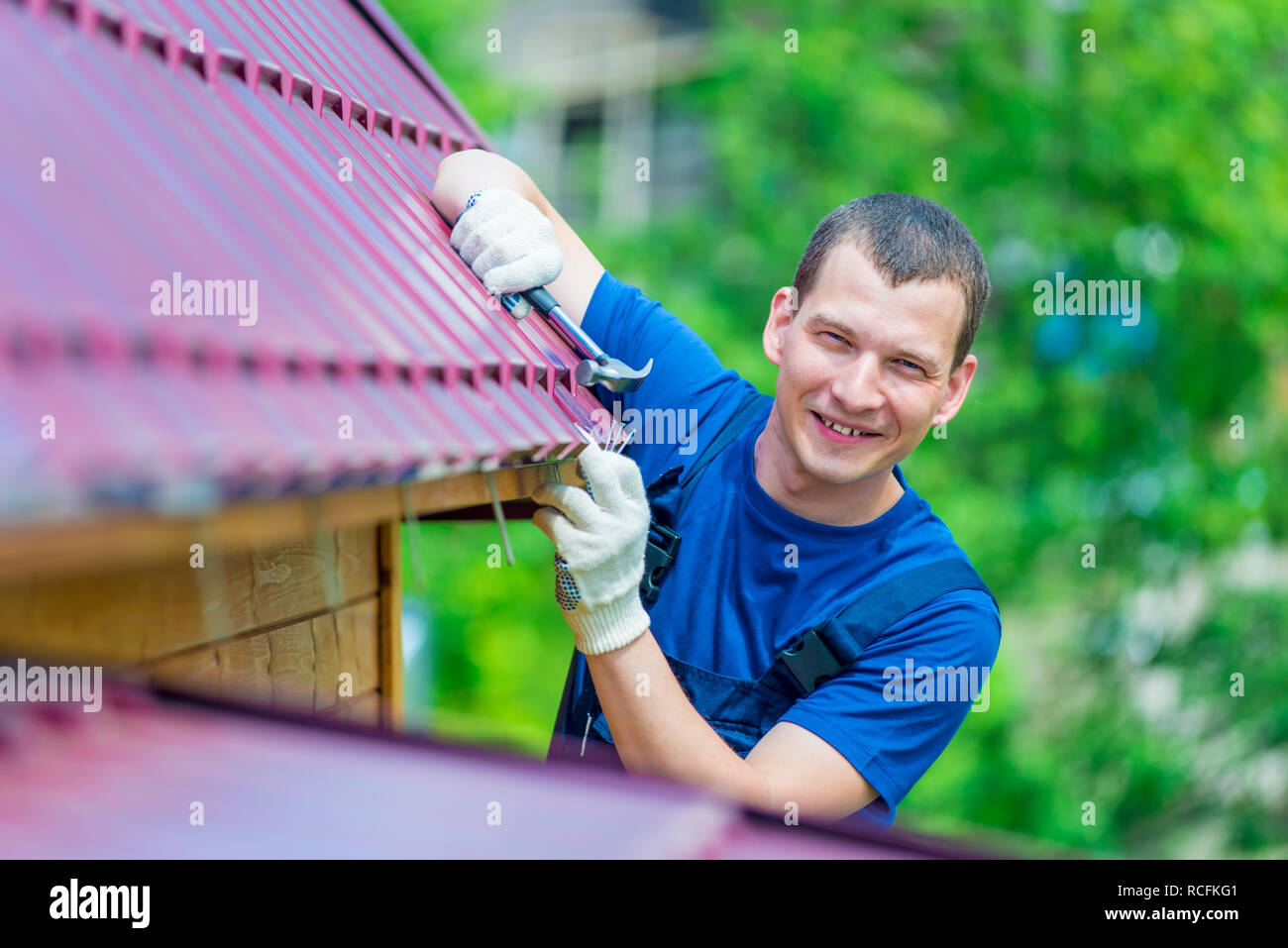 portrait of a successful experienced worker during roof repair Stock ...