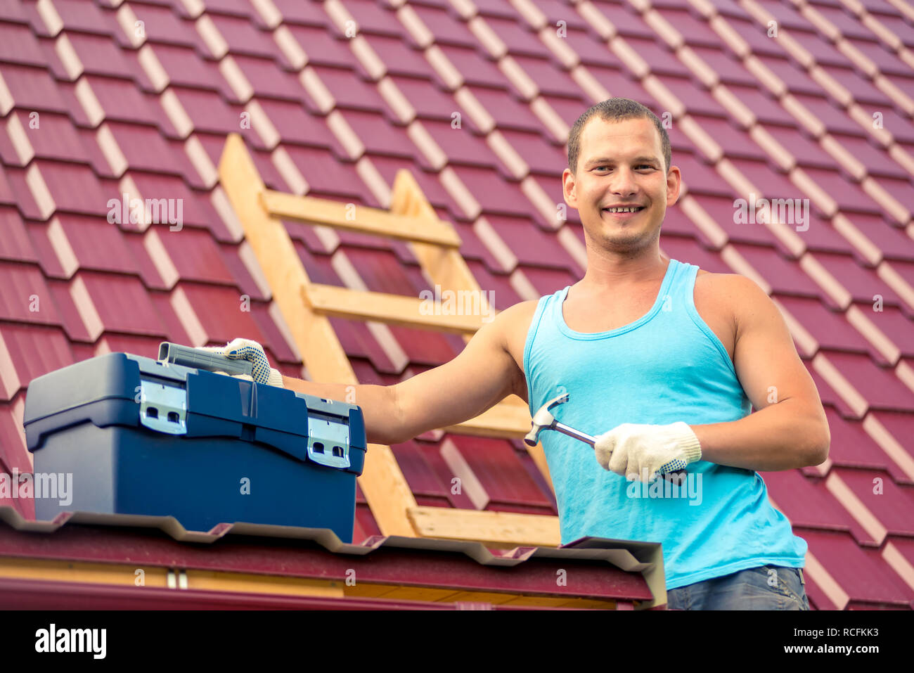 Man fixing roof tiles hi-res stock photography and images - Alamy