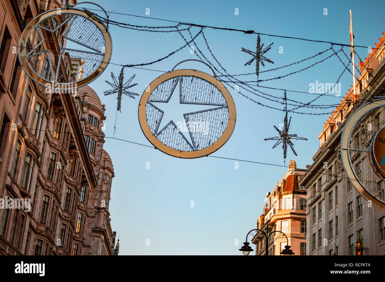 Star shapes and other electric decorations hanging in london streets ...