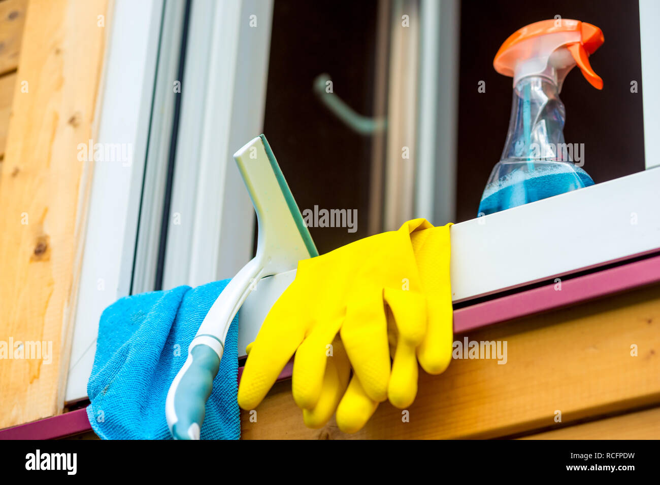 on the window sill close-up are tools for cleaning the glass window ...