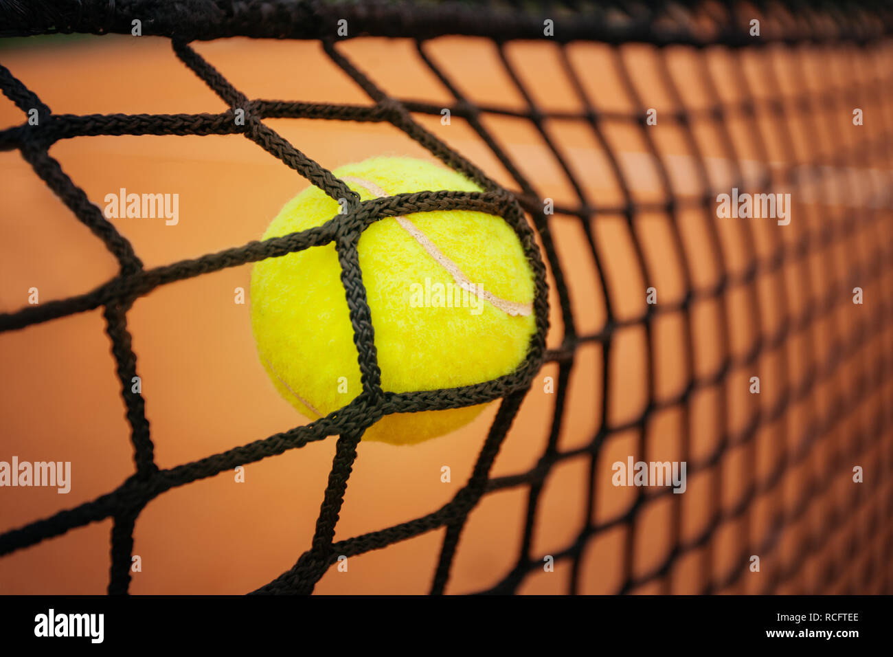 Tennis ball hitting the tennis net. Tennis ball in the net Stock Photo ...