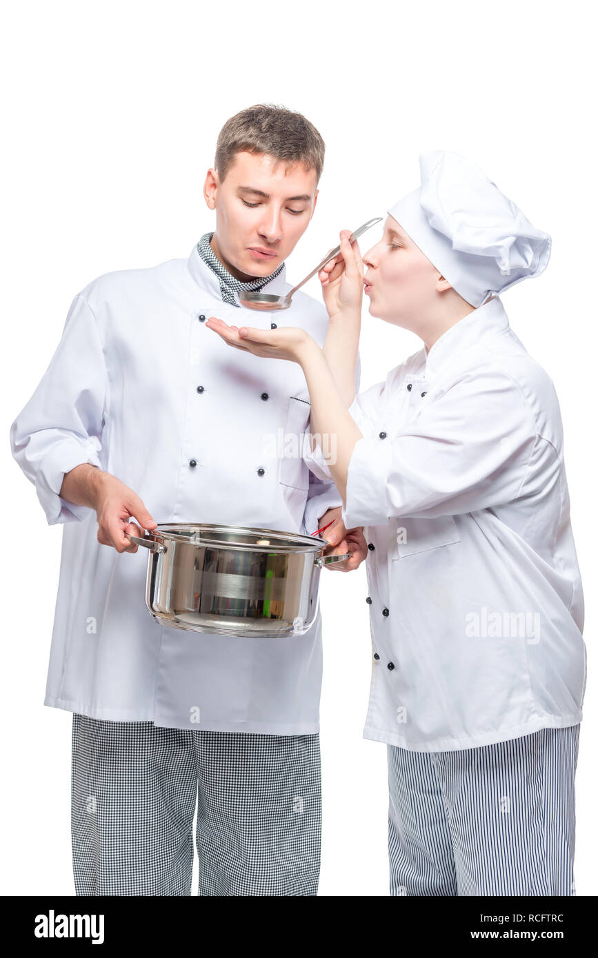 two chefs in suits try the cooked soup on a white background Stock ...