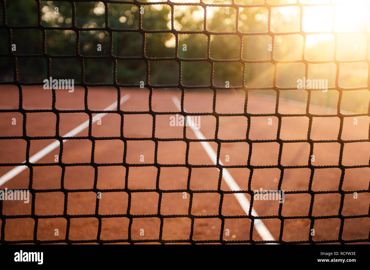 Tennis court at sunset Stock Photo - Alamy