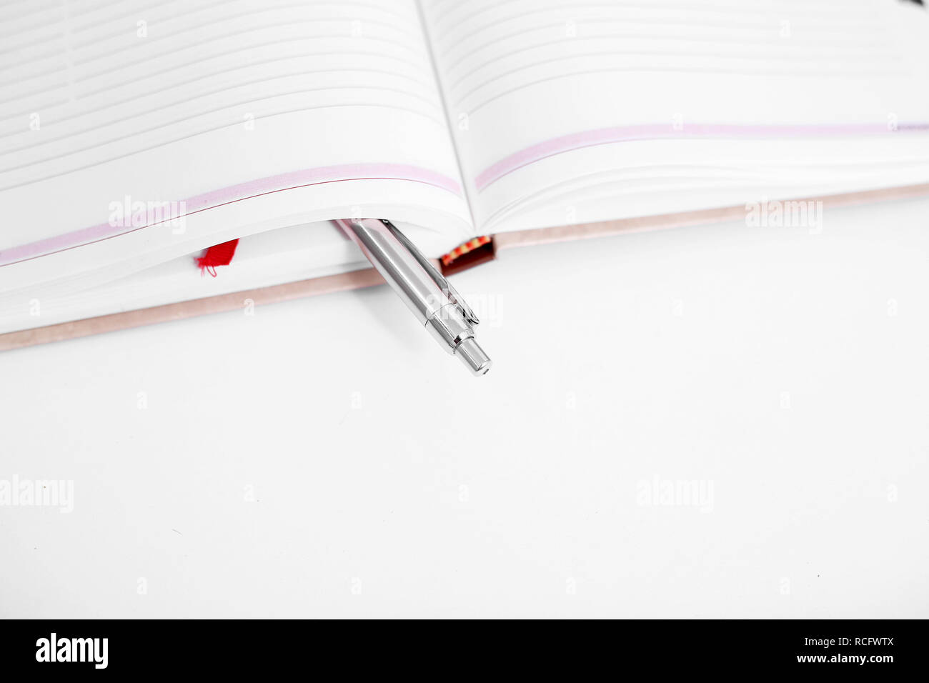 Picture of diary with pen. Isolated on the white background Stock Photo ...