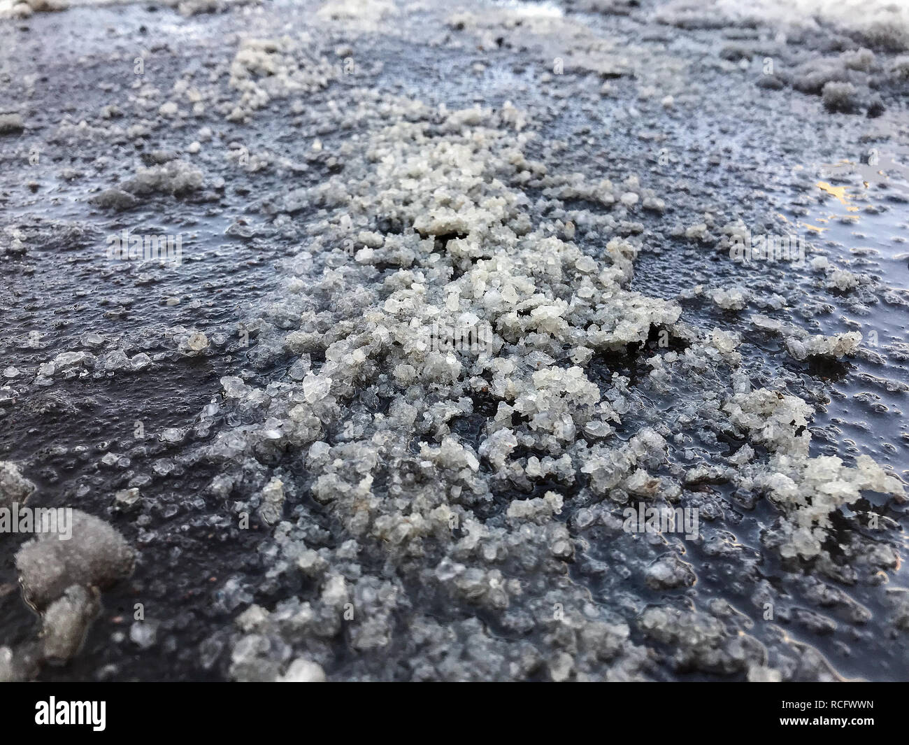 Salt on icy pavement hi-res stock photography and images - Alamy