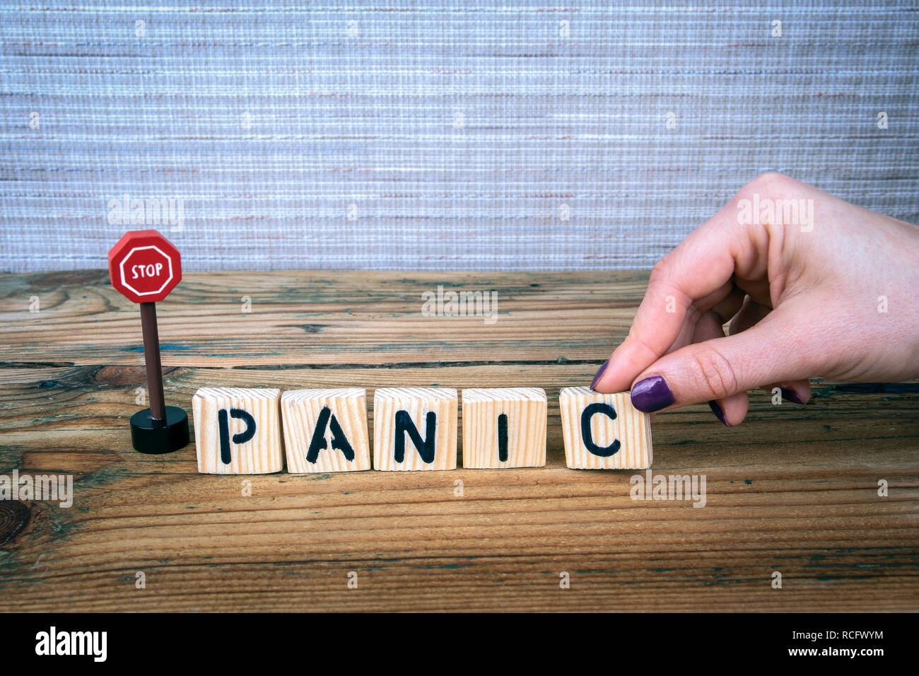 panic concept. Wooden letters on the office desk Stock Photo - Alamy