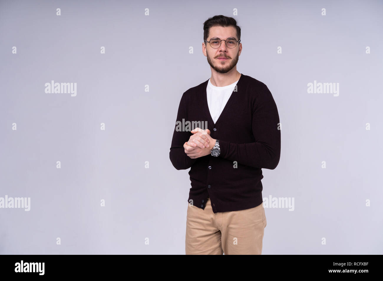 Portrait of sad upset young guy looking at camera over white background ...