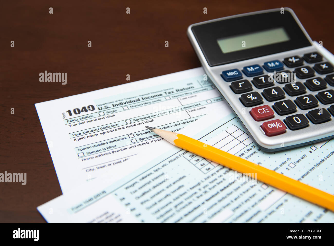 Pen on US TAX form Background. Tax Day concept Stock Photo - Alamy
