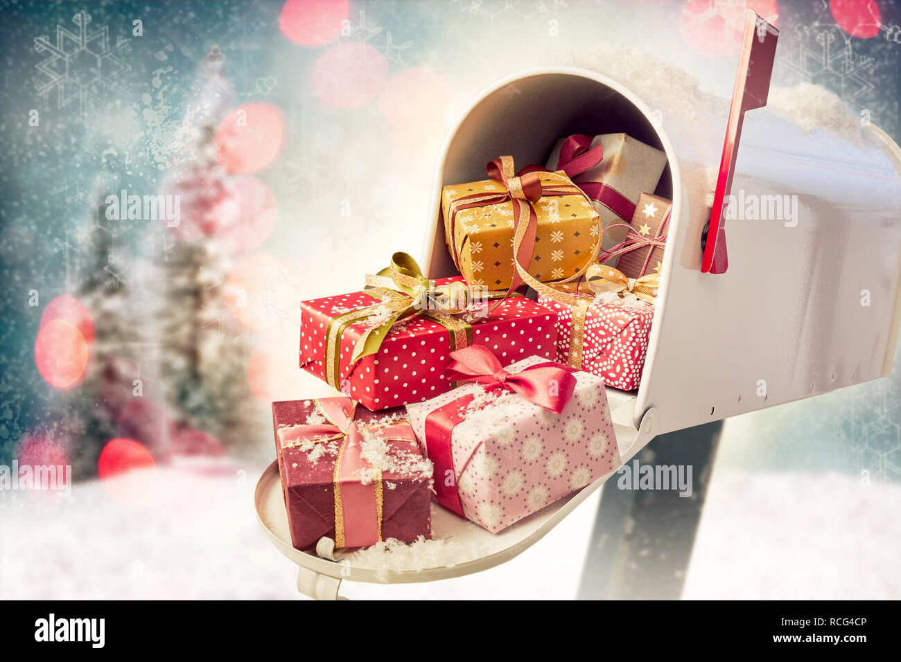 Holiday presents in the open full mailbox with Christmas decorations ...