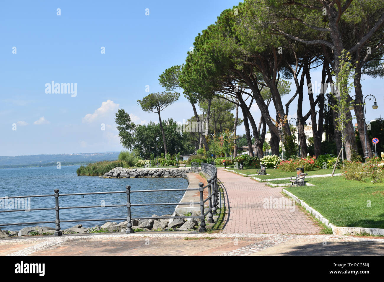 view of the lakefront by day with pedestrian street and sea Stock Photo ...
