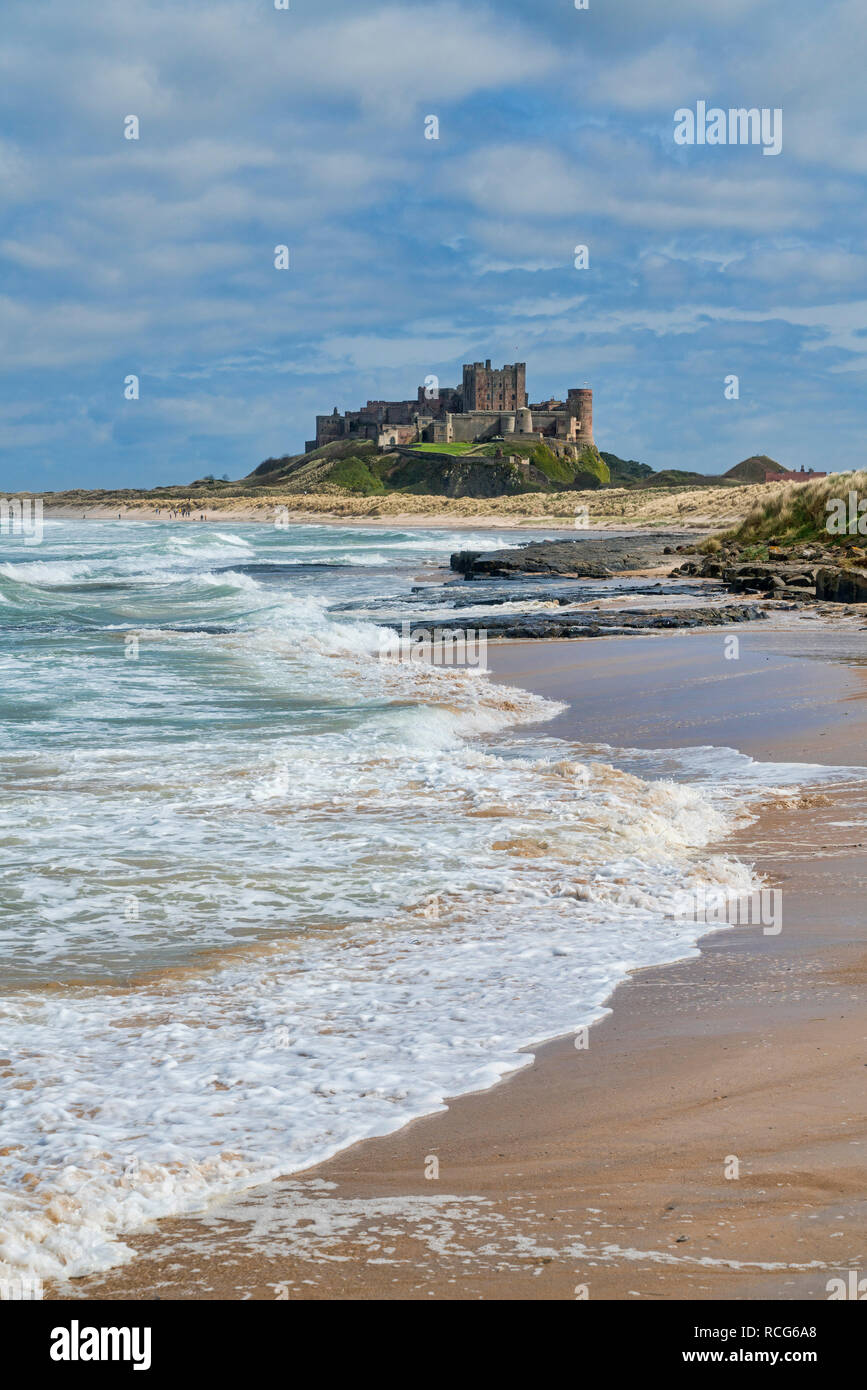 Looking along beach, coast to Bamburgh, Castle, Northumberland, England ...