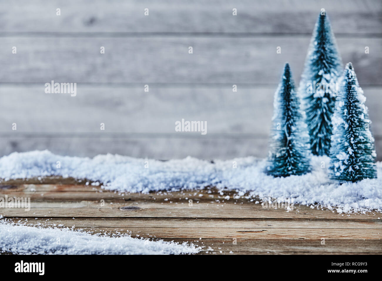 Christmas seasonal background with copy space and winter snow on rustic ...