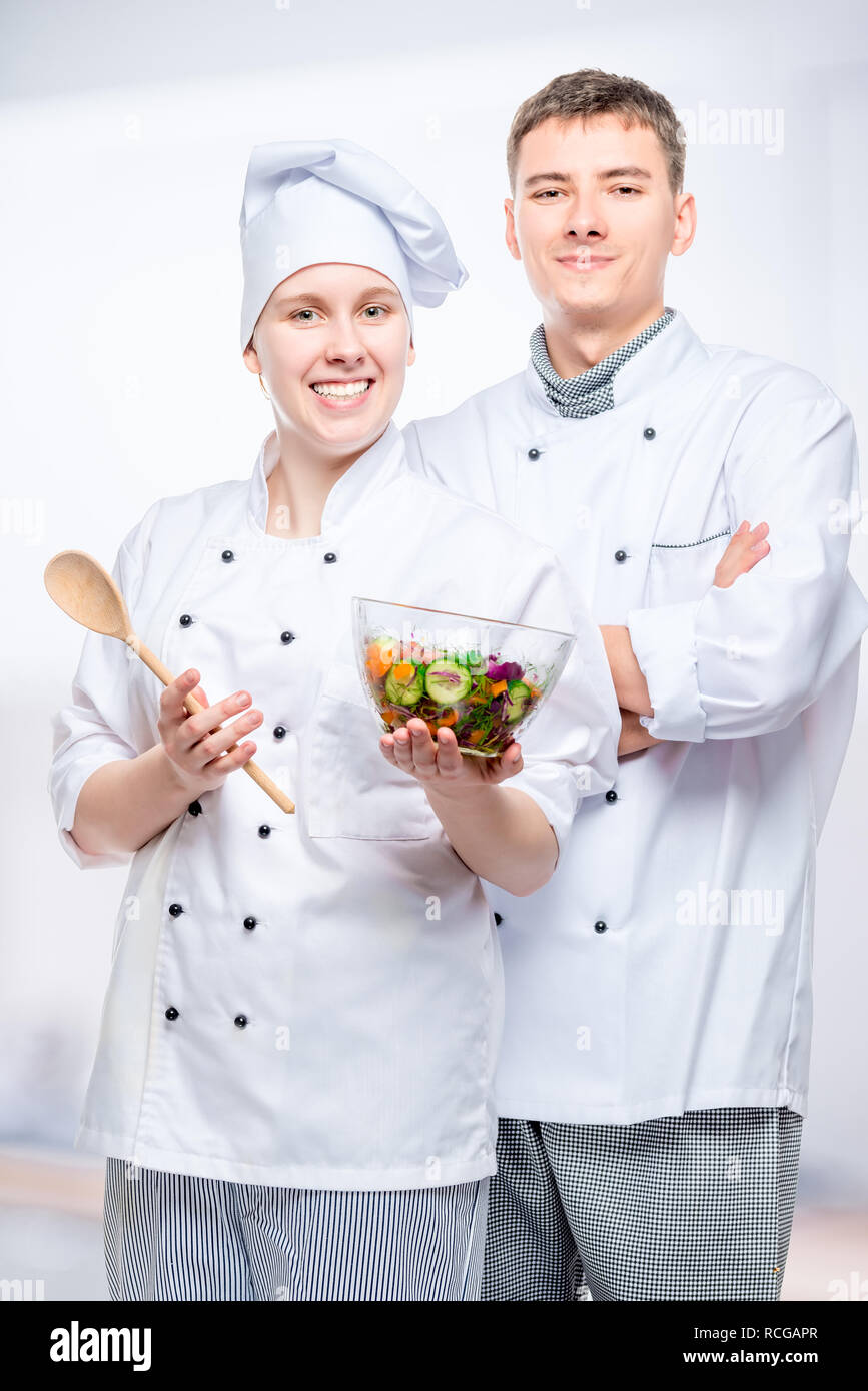 vertical portrait of successful chefs with salad Stock Photo - Alamy