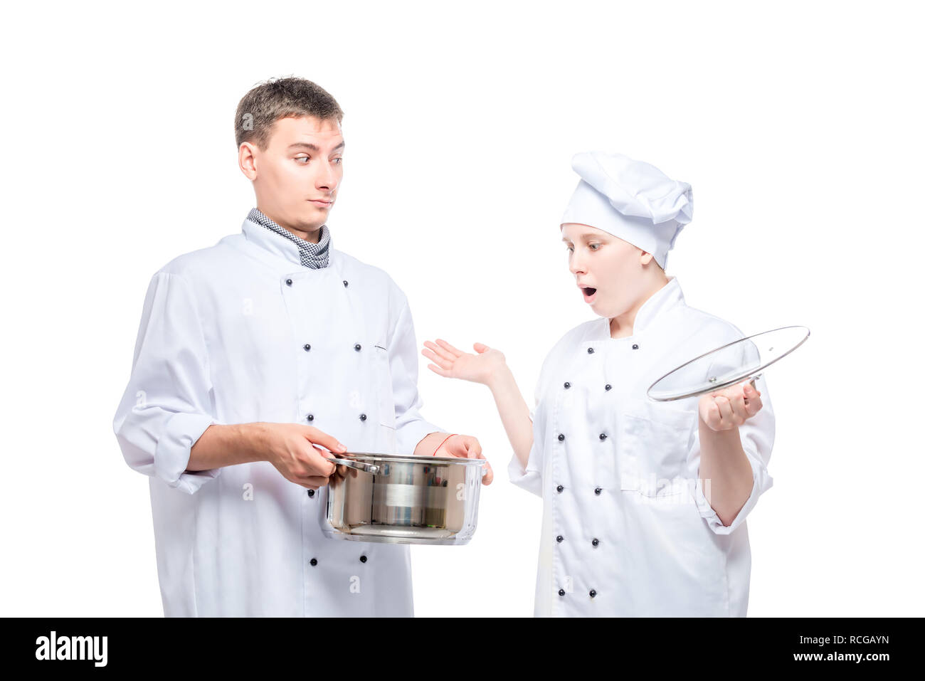 surprised cook looks at soup in a pan of another chef on a white ...