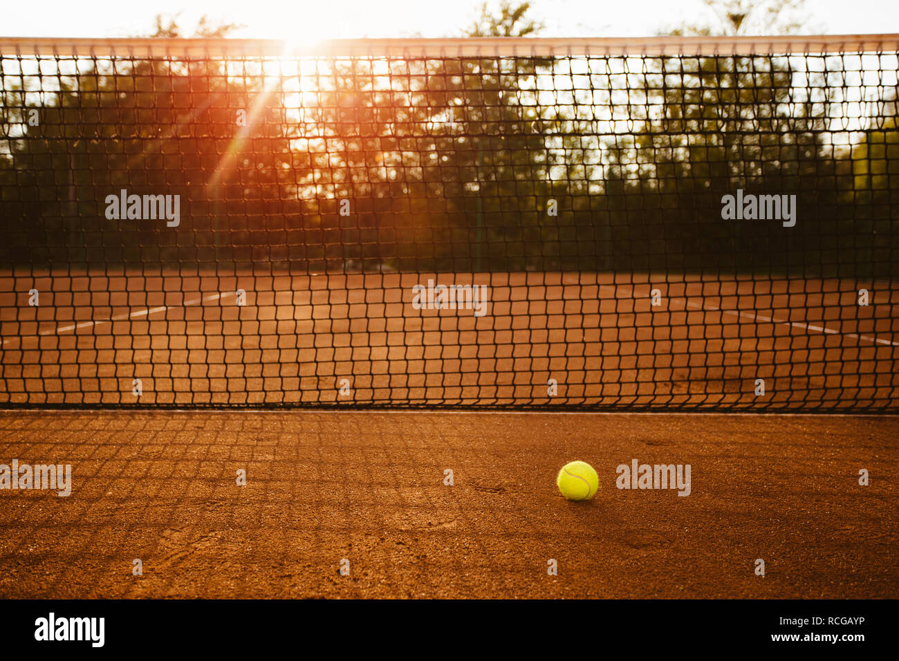 Tennis court at sunset Stock Photo - Alamy