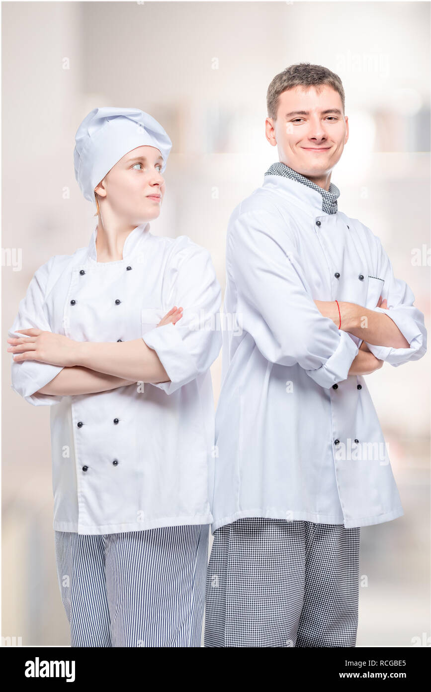 vertical portrait of a successful team of professional chefs in suits ...