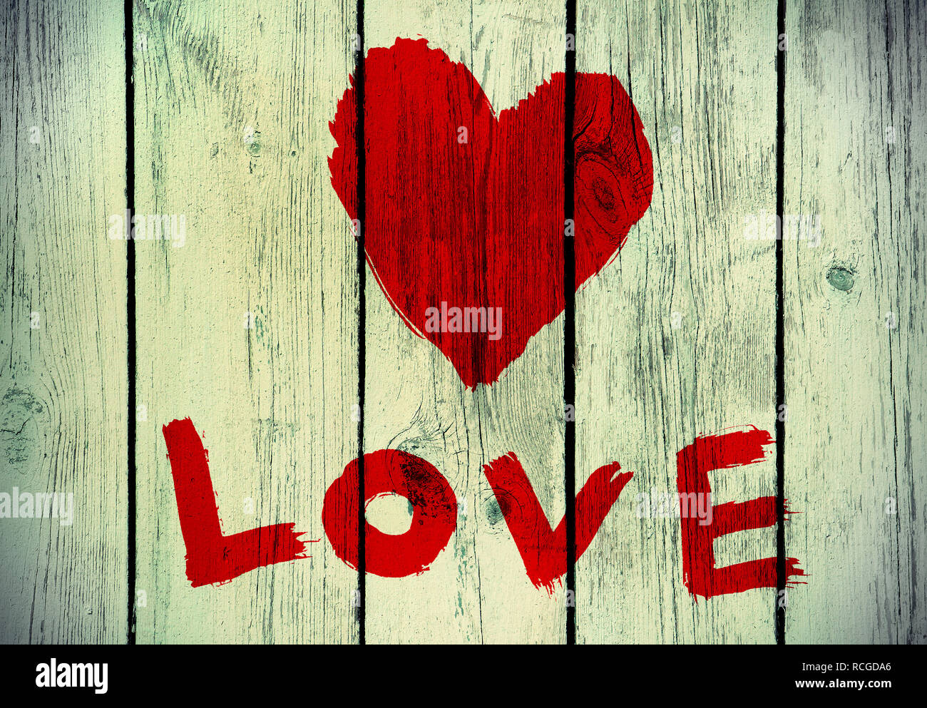 drawing love symbol and word ''love'' on old wooden wall Stock Photo ...