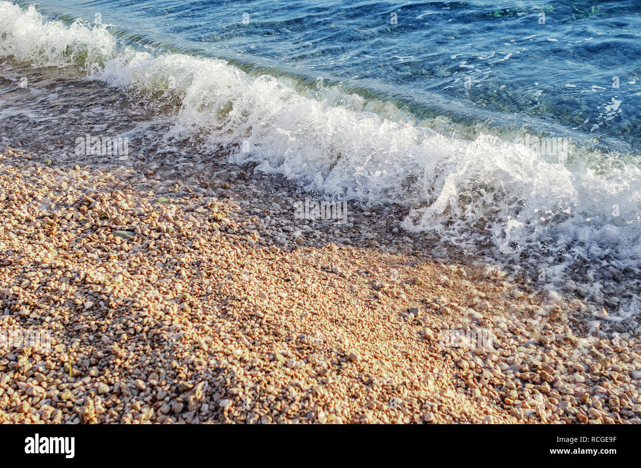 Sea surf on a stony beach Stock Photo - Alamy