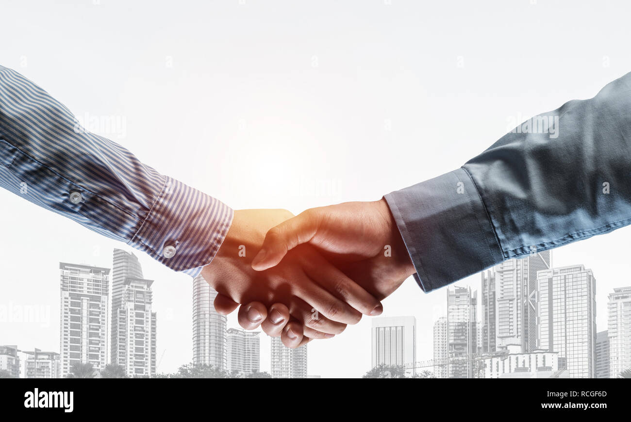 Business handshake as idea for unity and cooperation or greeting Stock ...