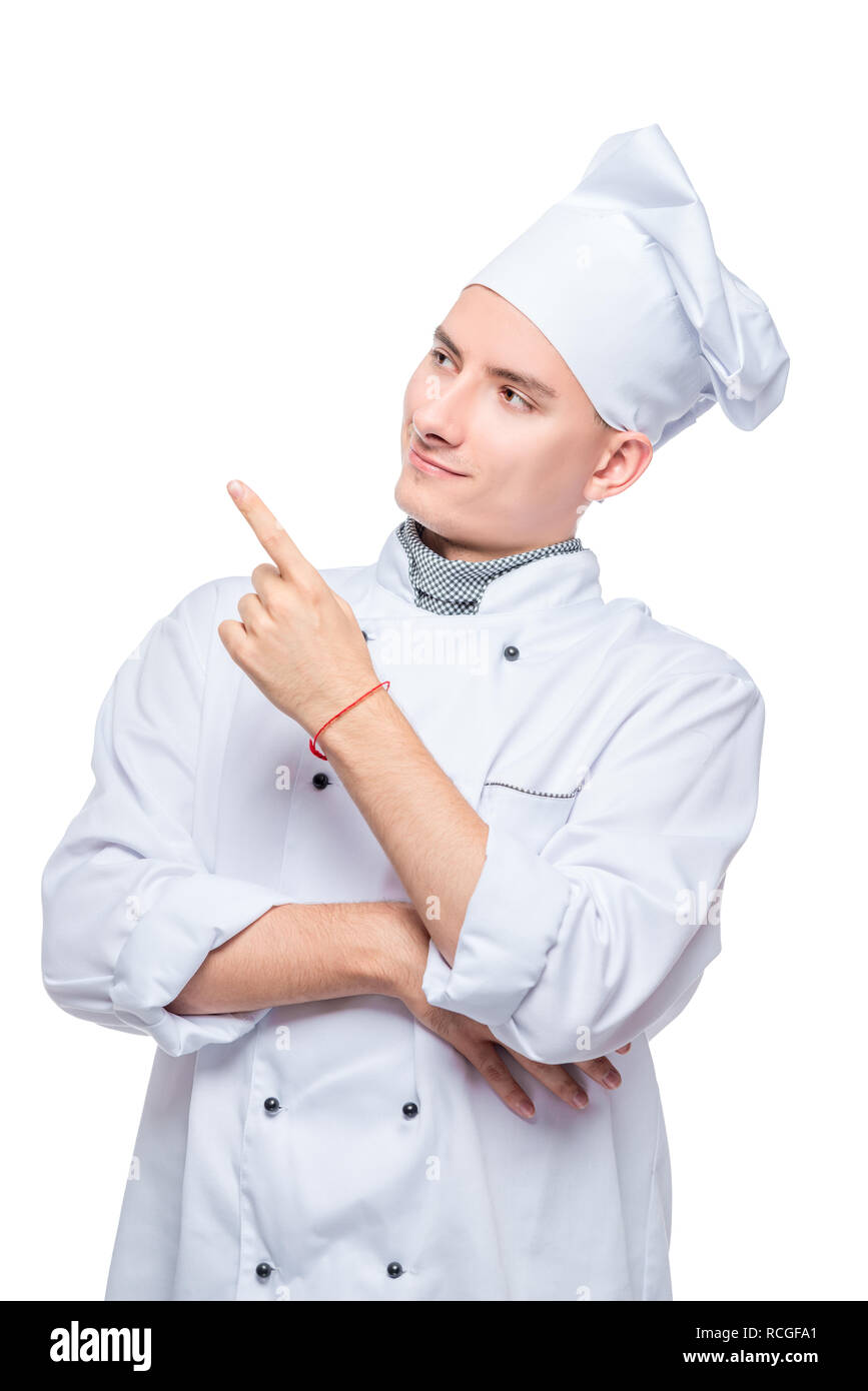 cook in uniform points his finger at something to the side, portrait on ...
