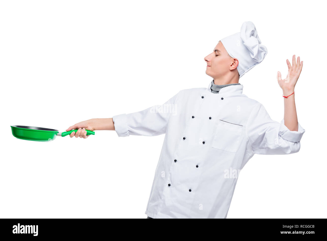 professional chef with a frying pan on a white background in the studio ...