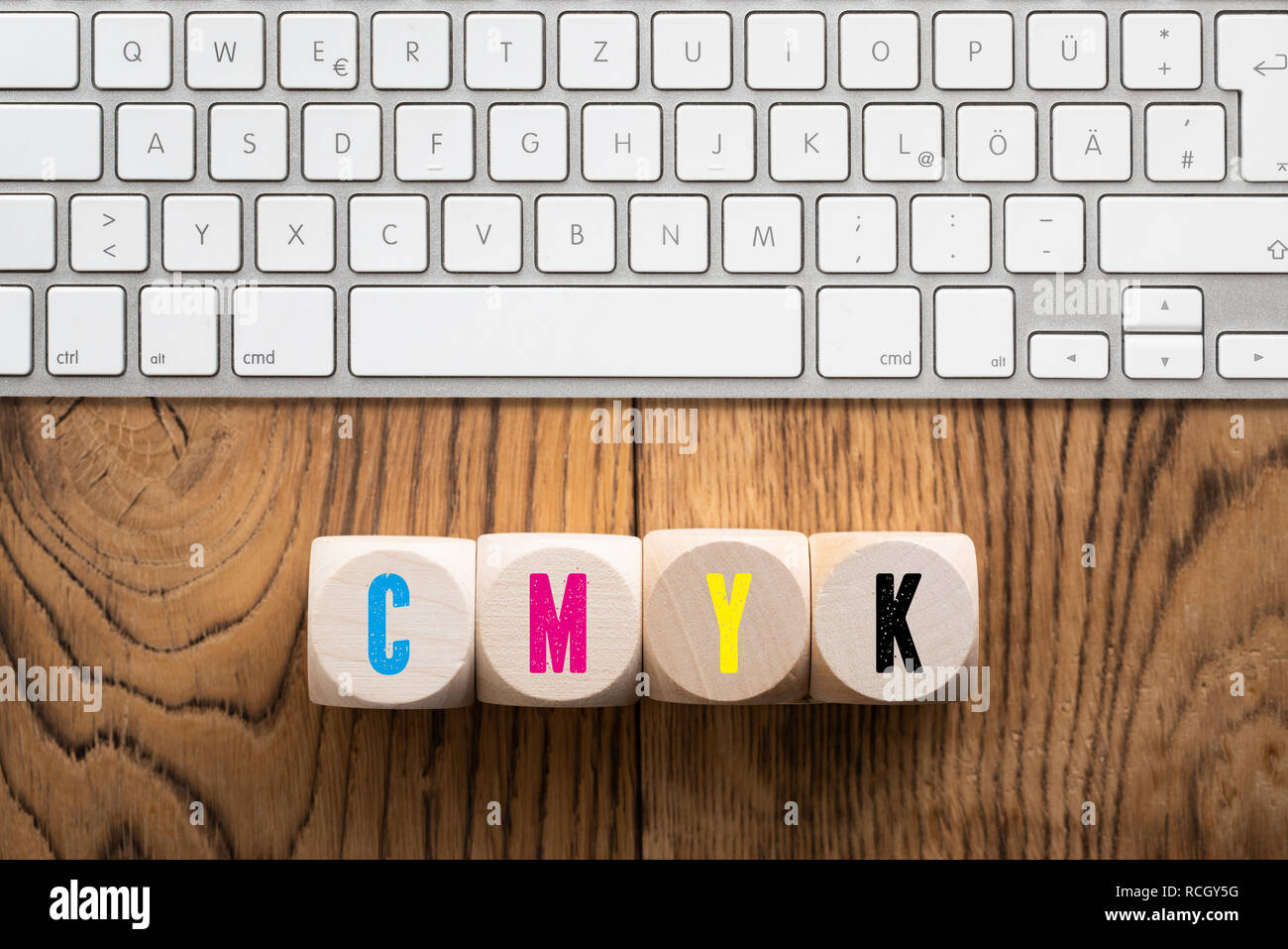 cubes with colored letters for CMYK on wooden background Stock Photo ...