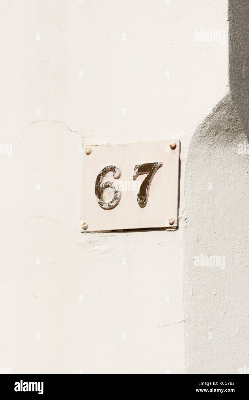 House number 67 sign on wall hi-res stock photography and images - Alamy