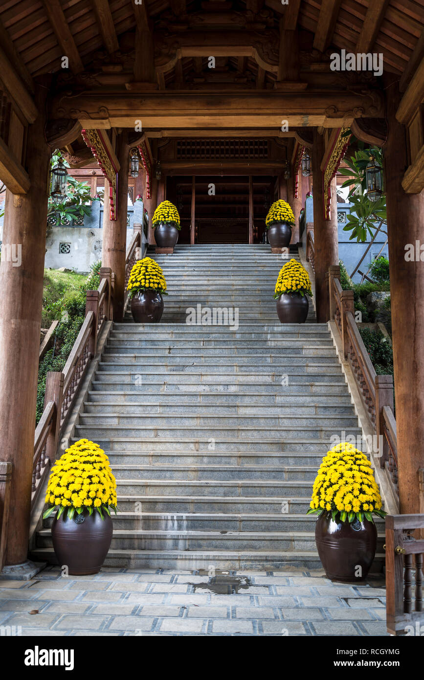 Bai Dinh Buddhist Temple, Stately stairs with huge flowerpots with ...