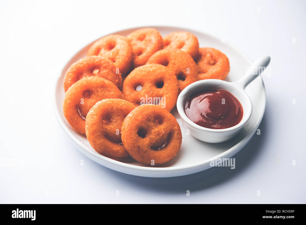 Crunchy potato smiling face snacks hi-res stock photography and images ...