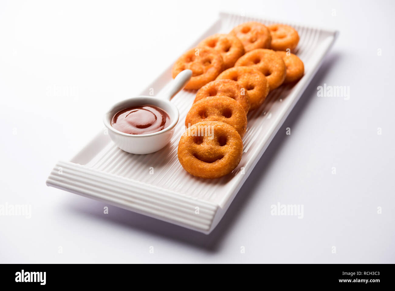 Crunchy potato smiling face snacks hi-res stock photography and images ...