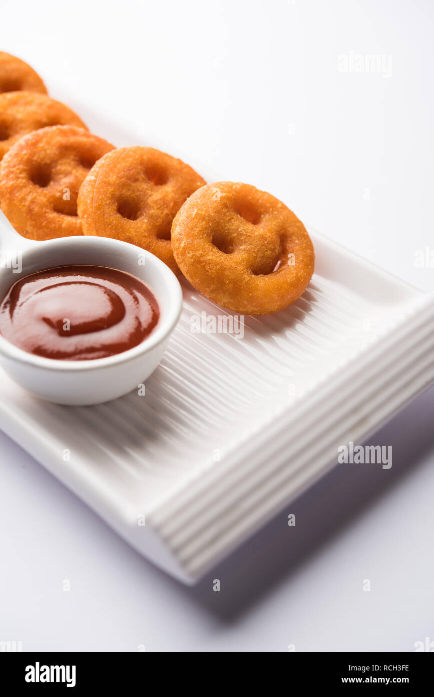 Crunchy potato smiling face snacks hi-res stock photography and images ...