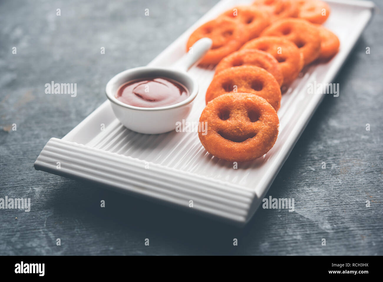 Crunchy potato smiling face snacks hi-res stock photography and images ...