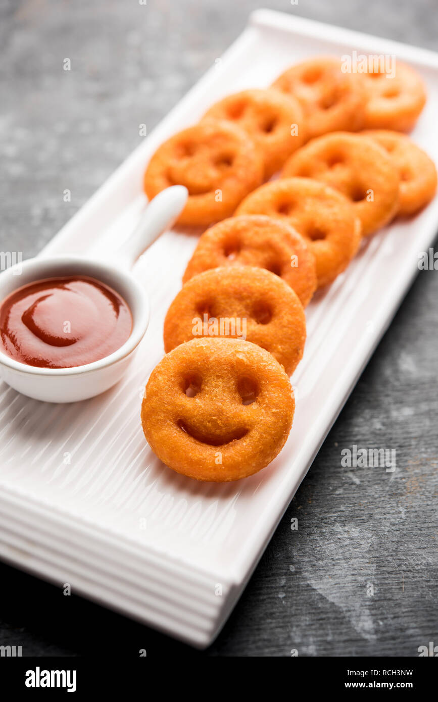 Crunchy potato smiling face snacks hi-res stock photography and images ...