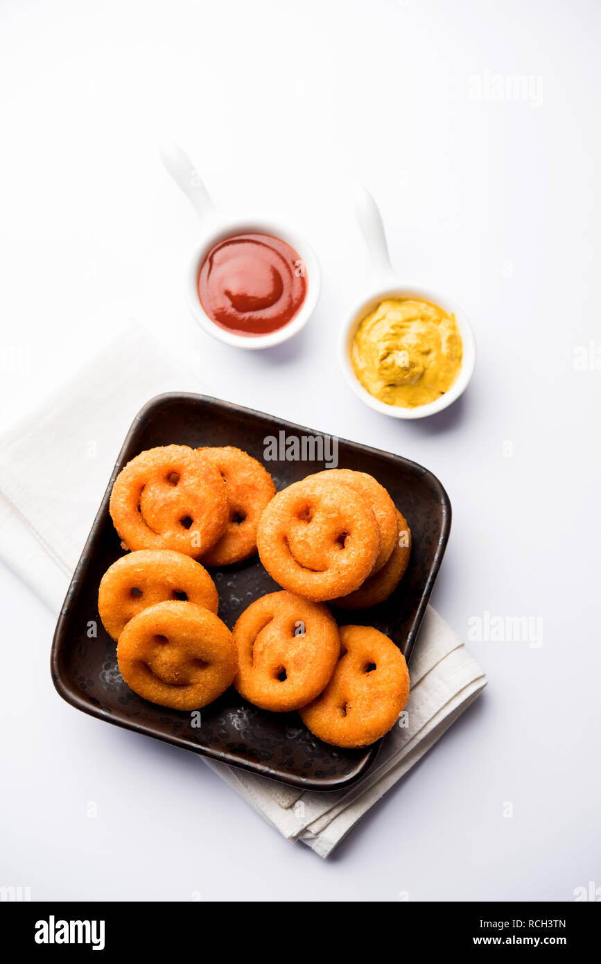 Crunchy potato smiling face snacks hi-res stock photography and images ...
