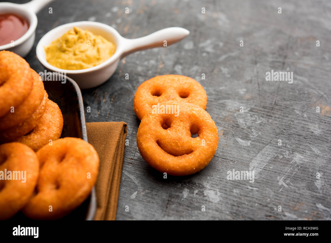 Crunchy potato smiling face snacks hi-res stock photography and images ...