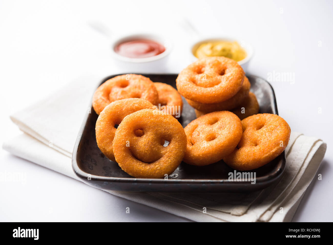 Crunchy potato smiling face snacks hi-res stock photography and images ...
