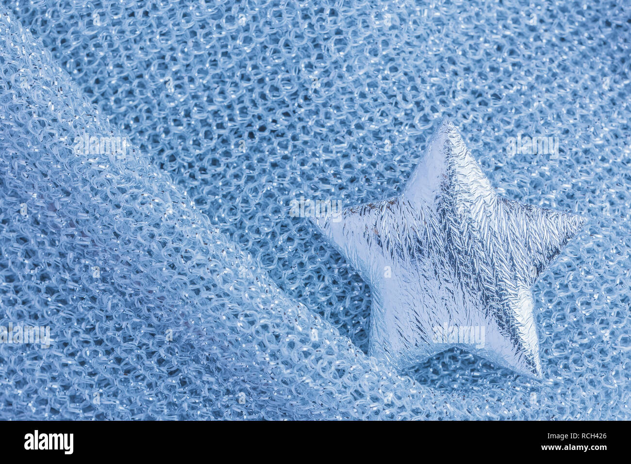 Shiny silver star on gray texture cloth Stock Photo - Alamy