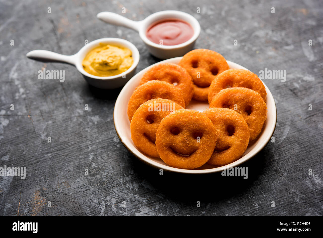 Crunchy potato smiling face snacks hi-res stock photography and images ...